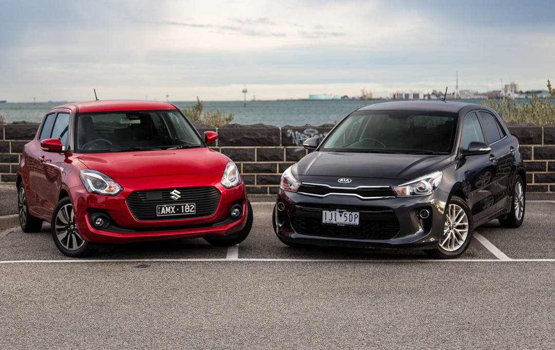 Suzuki Swift GLX Turbo v Kia Rio SLi comparison - GearOpen.com